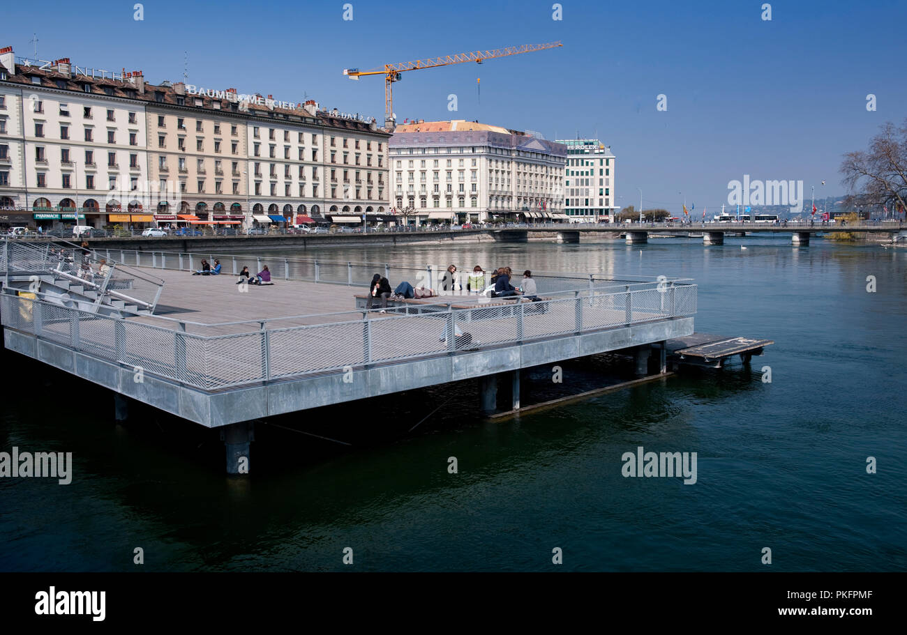 People enjoying the sun on the Pont de la Machine over the Rhône river ...