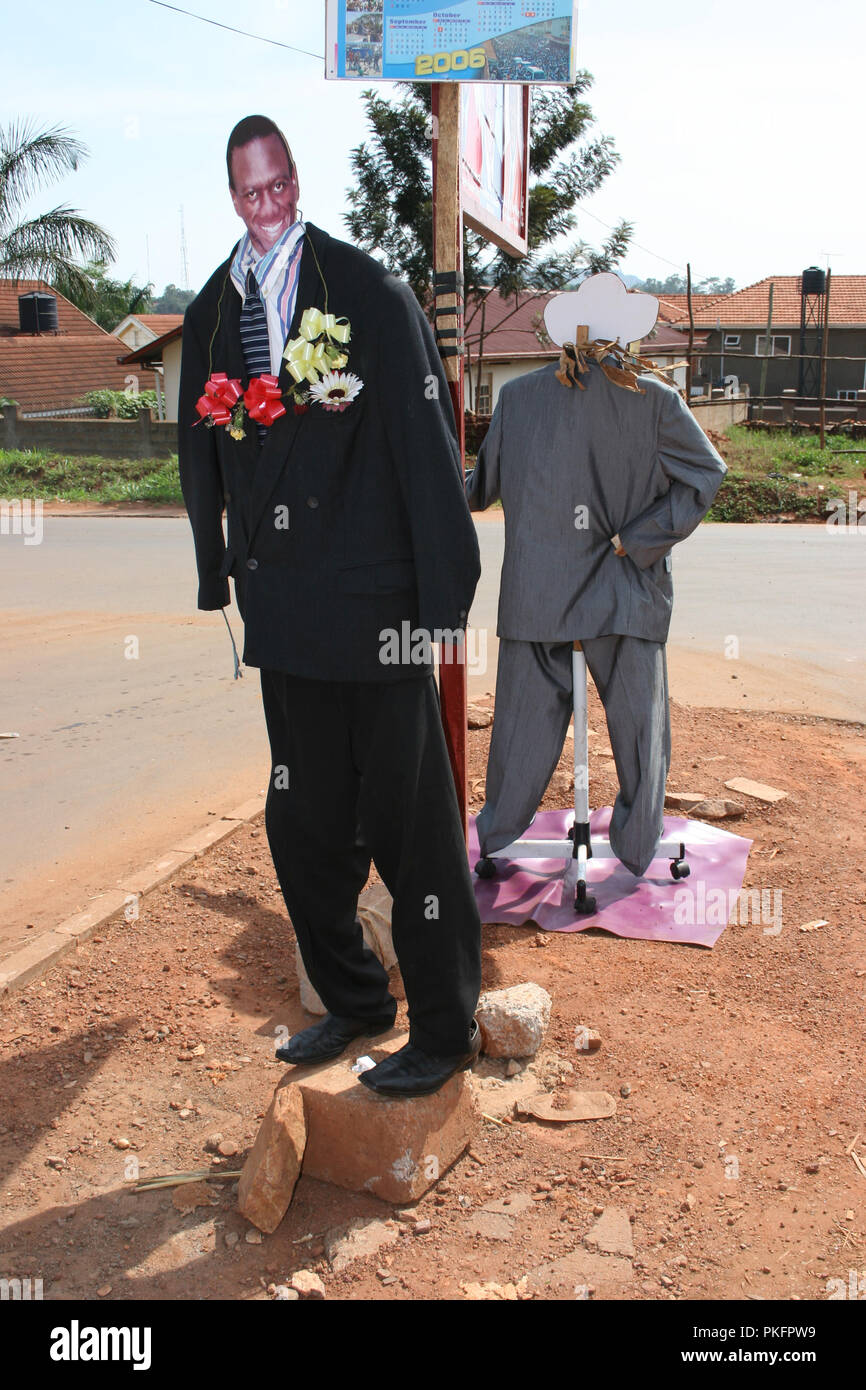 Effigies of opposition candidate Dr Kizza Besigye (facing) and ...