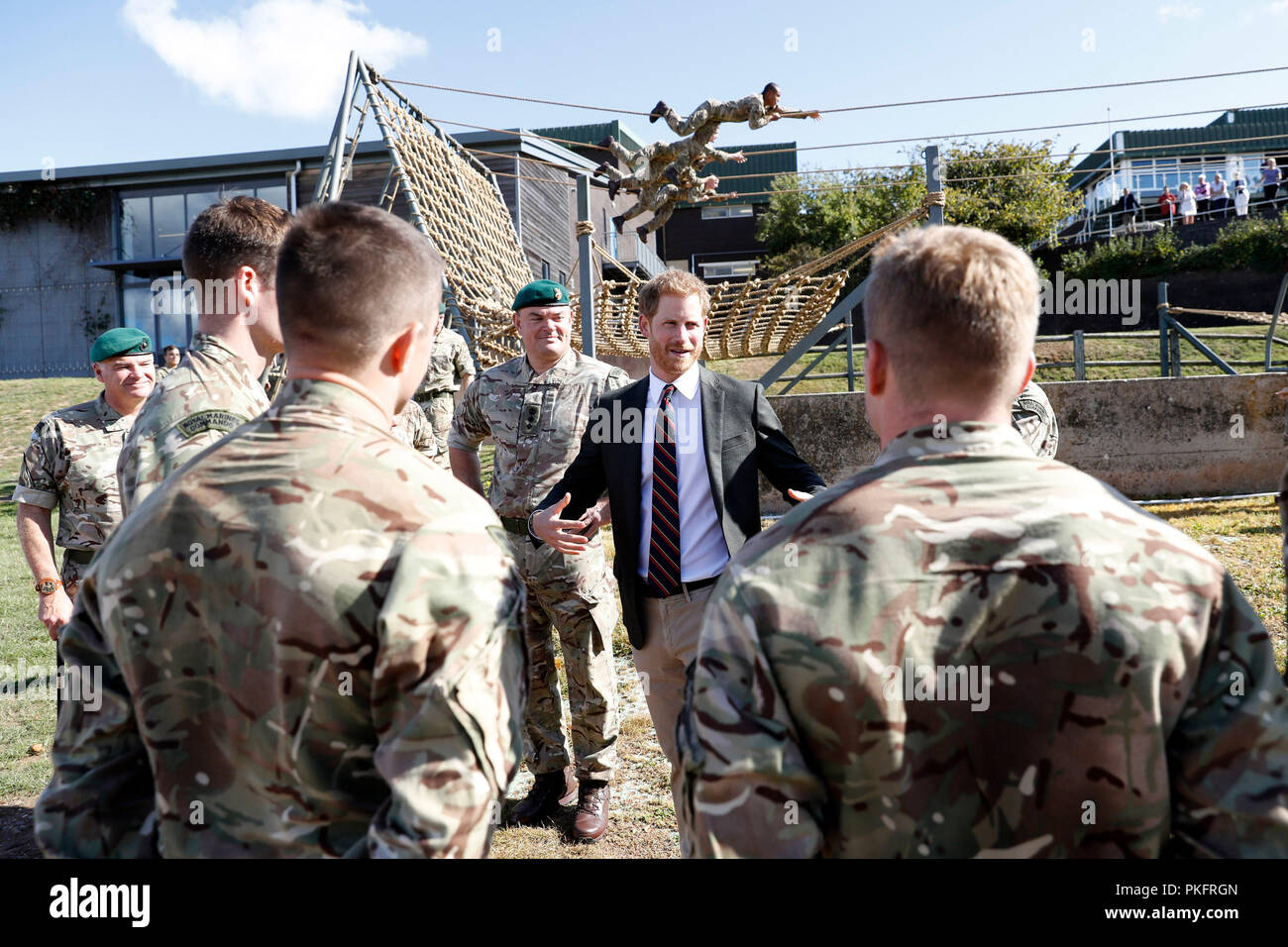 The Duke of Sussex talks to Commandos by the assault course during a ...