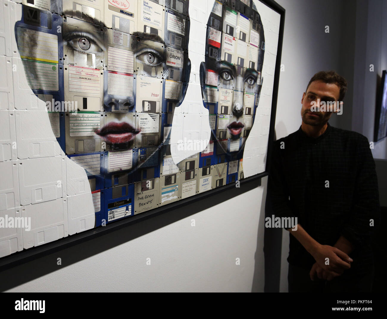 Nick Gentry stares at his work 'Combination 1' which is made of oil ...