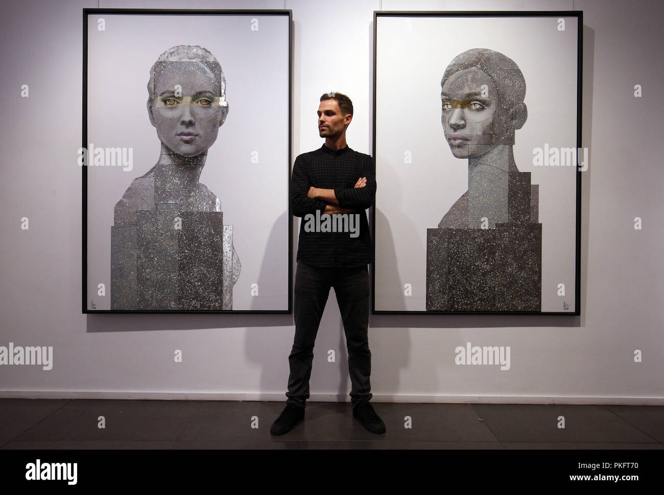 Nick Gentry stands between two pieces of his work 'Human Connection ...