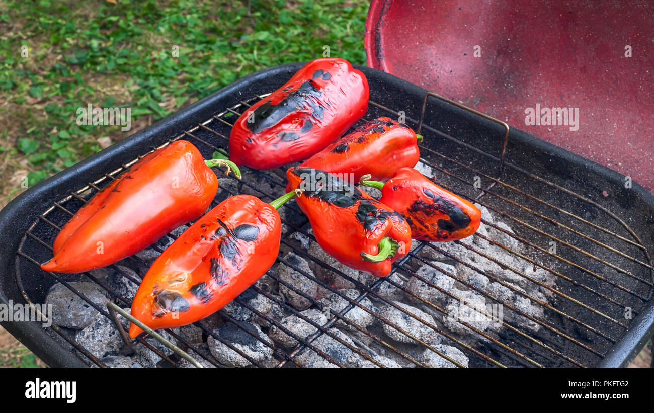 Roasted sweet red paprika on the grill almost finish Stock Photo - Alamy