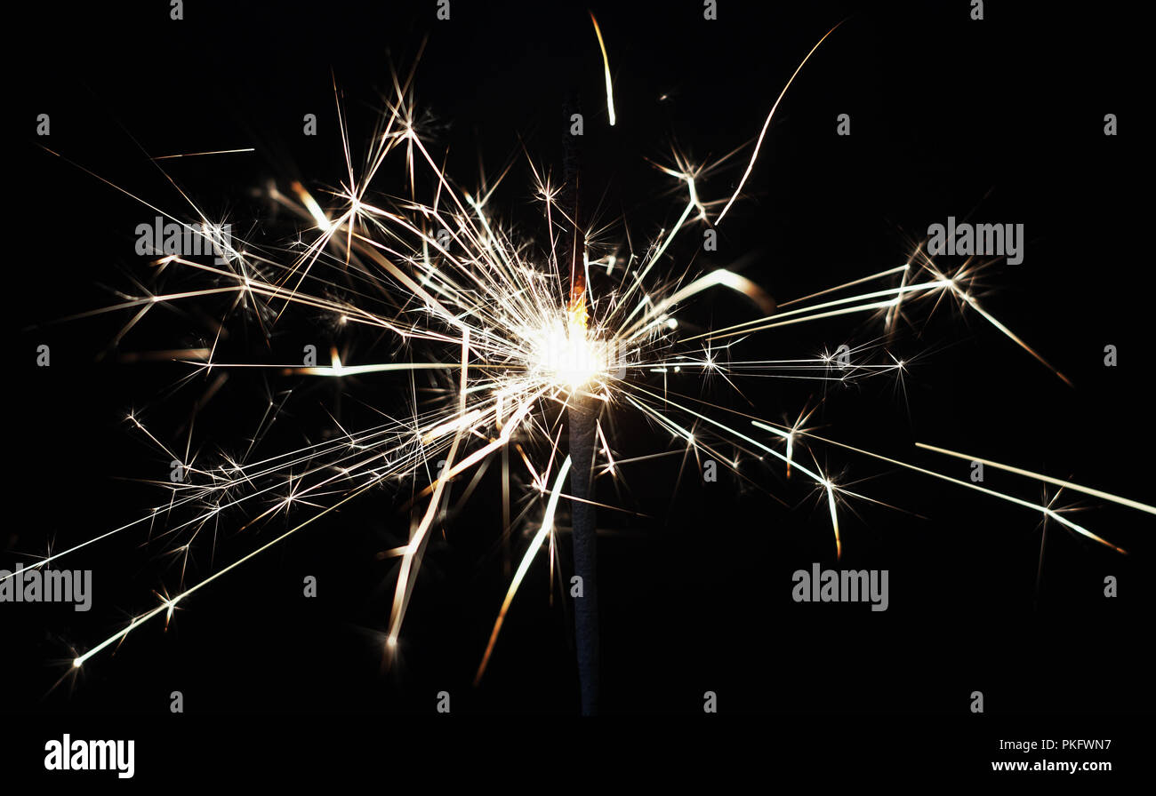 Gun powder sparks shot against dark background. New Year concept Stock ...
