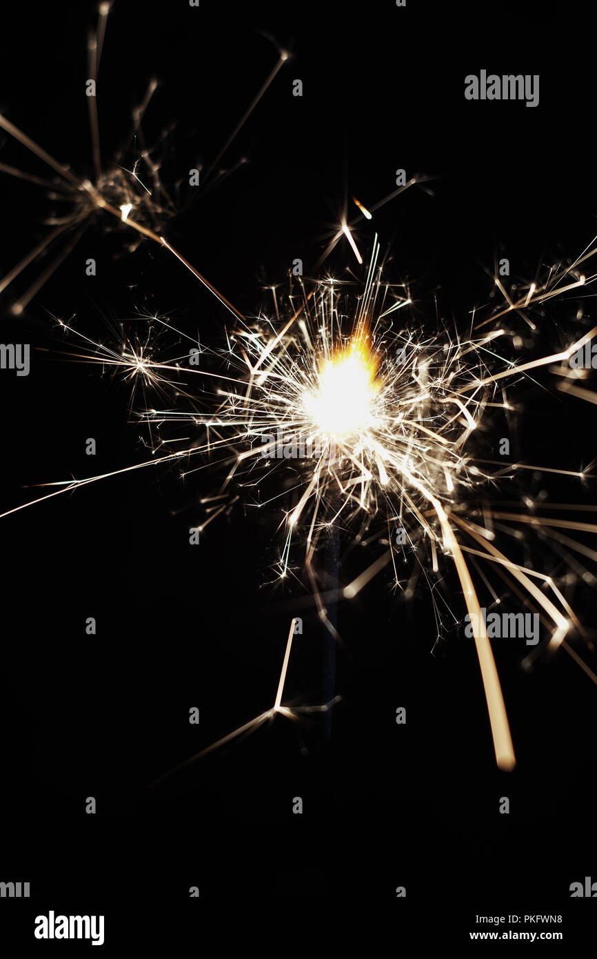 Gun powder sparks shot against dark background Stock Photo - Alamy