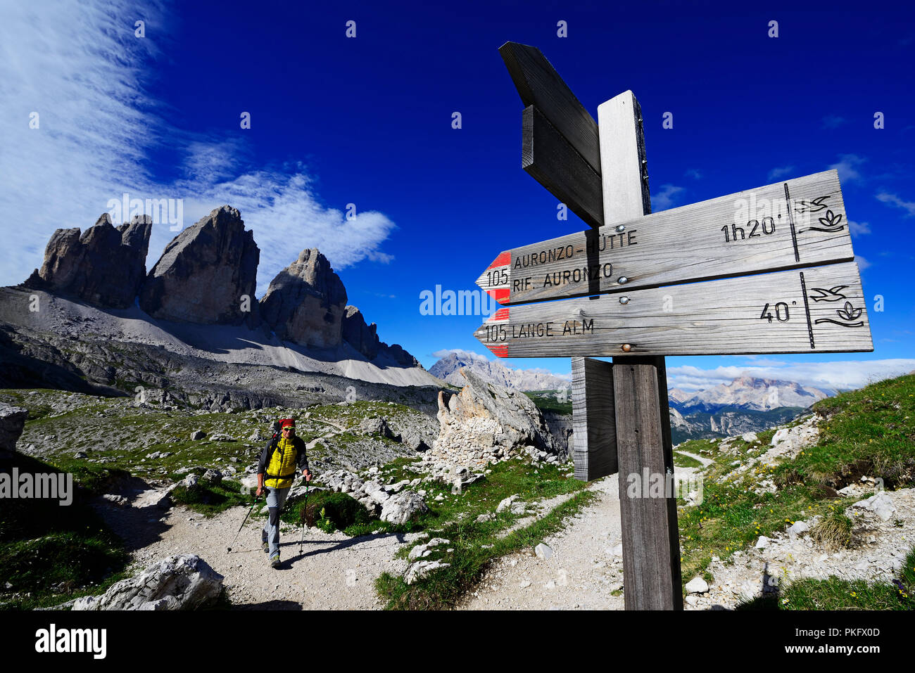 Hiker below the Drei Zinnen-Hütte in front of the northern walls of the ...
