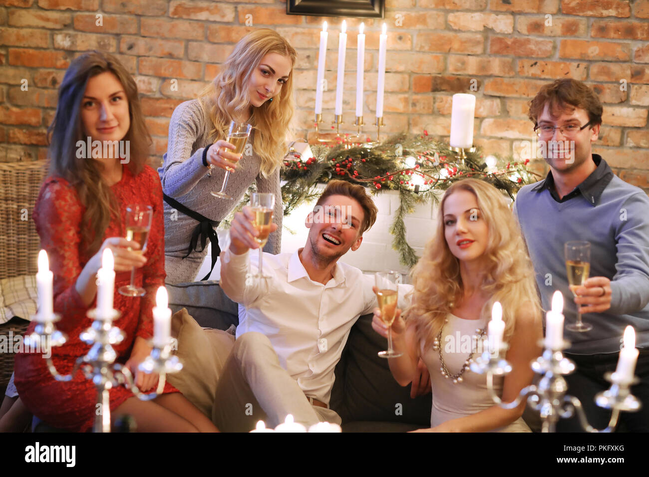 Celebration of Christmas in close group of friends Stock Photo - Alamy