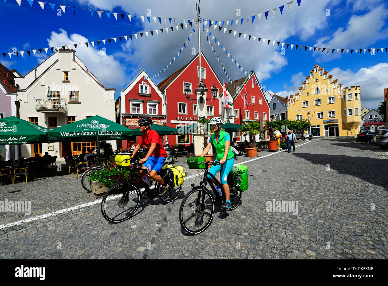 Cyclists in the old town of Abensberg, Eastern Bavaria, Lower Bavaria ...