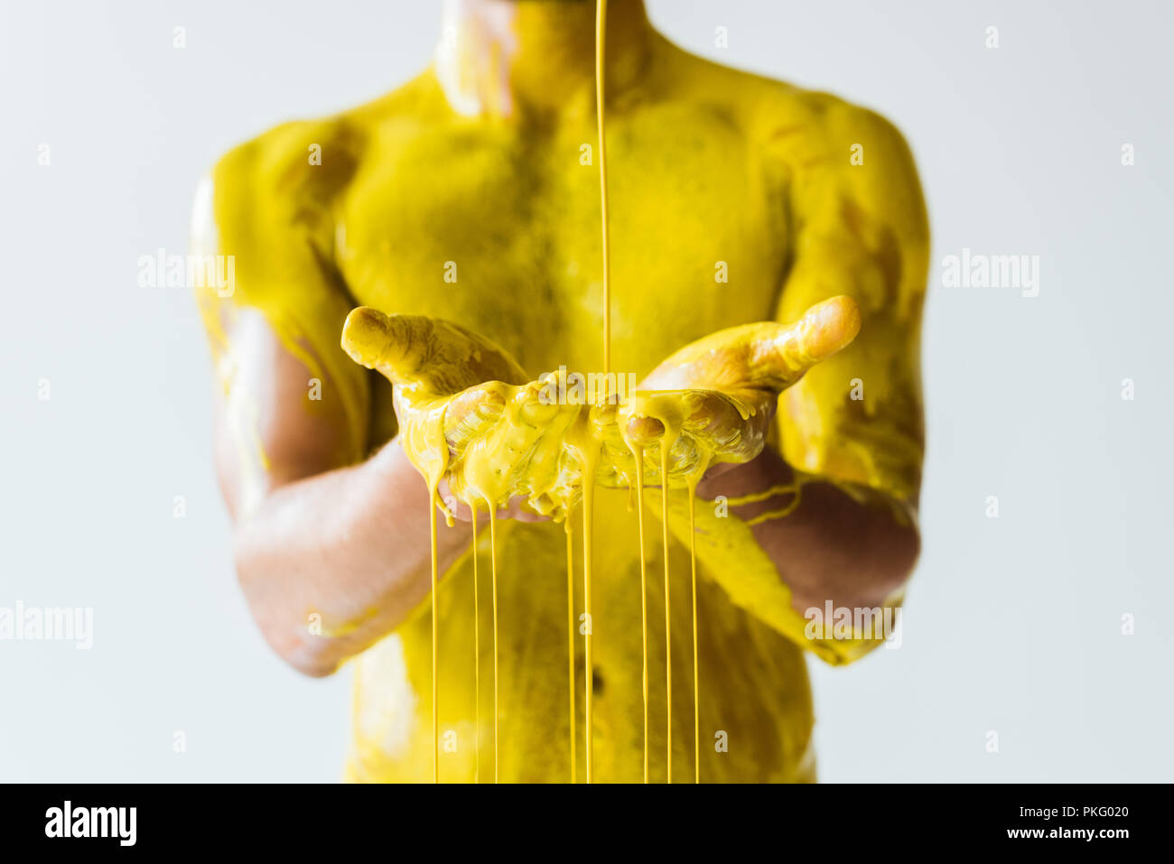 Pouring yellow paint hi-res stock photography and images - Alamy