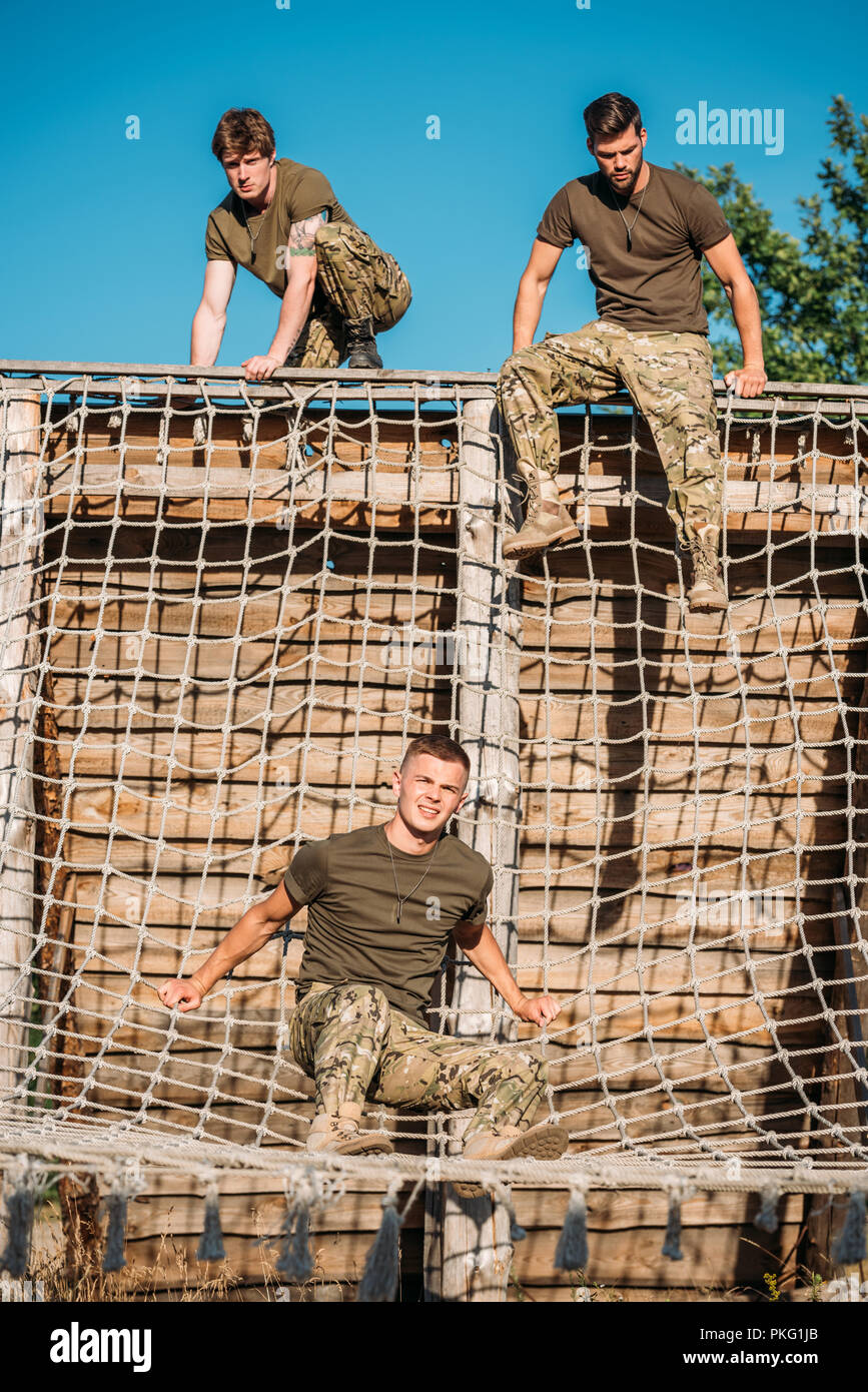 young soldiers practicing during obstacle run on range Stock Photo - Alamy