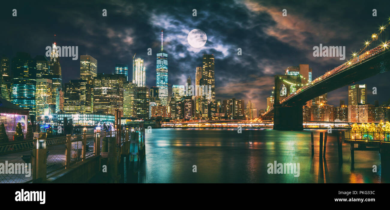 New York City Brooklyn Bridge and Manhattan skyline illuminated at ...