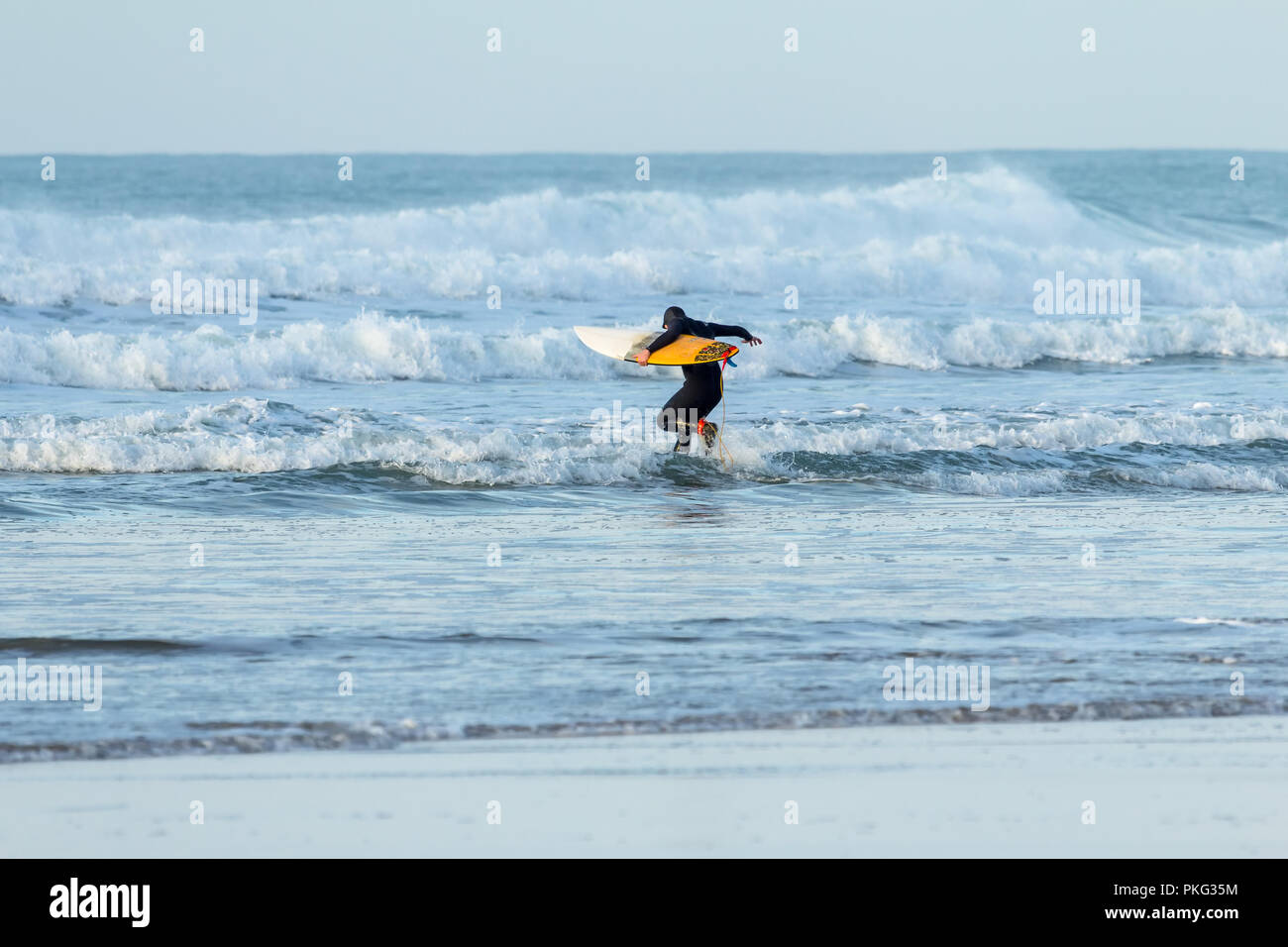 Running into surf hi-res stock photography and images - Alamy