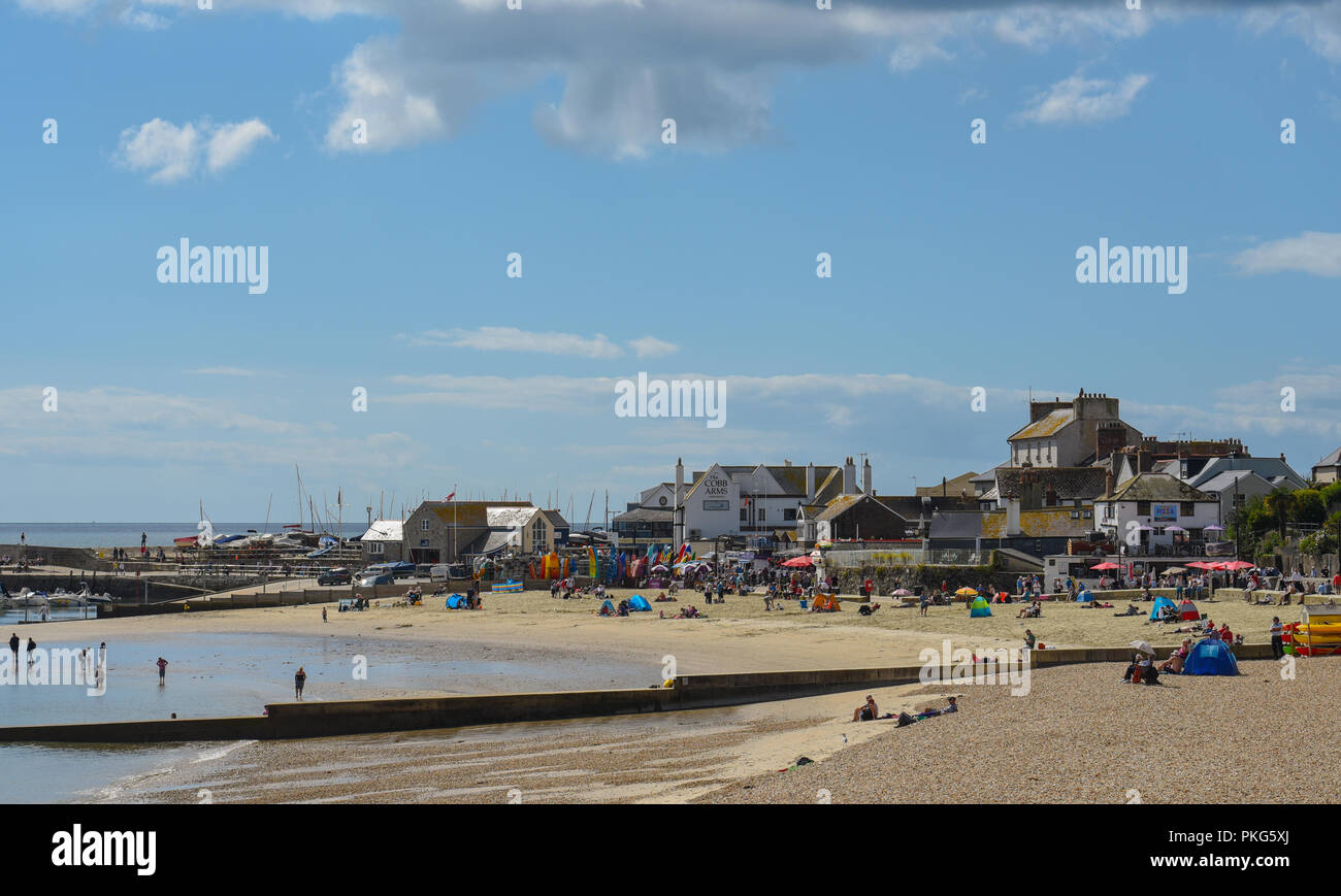 Lyme Regis, Dorset, UK. 13th September 2018. UK Weather: Visitors enjoy ...