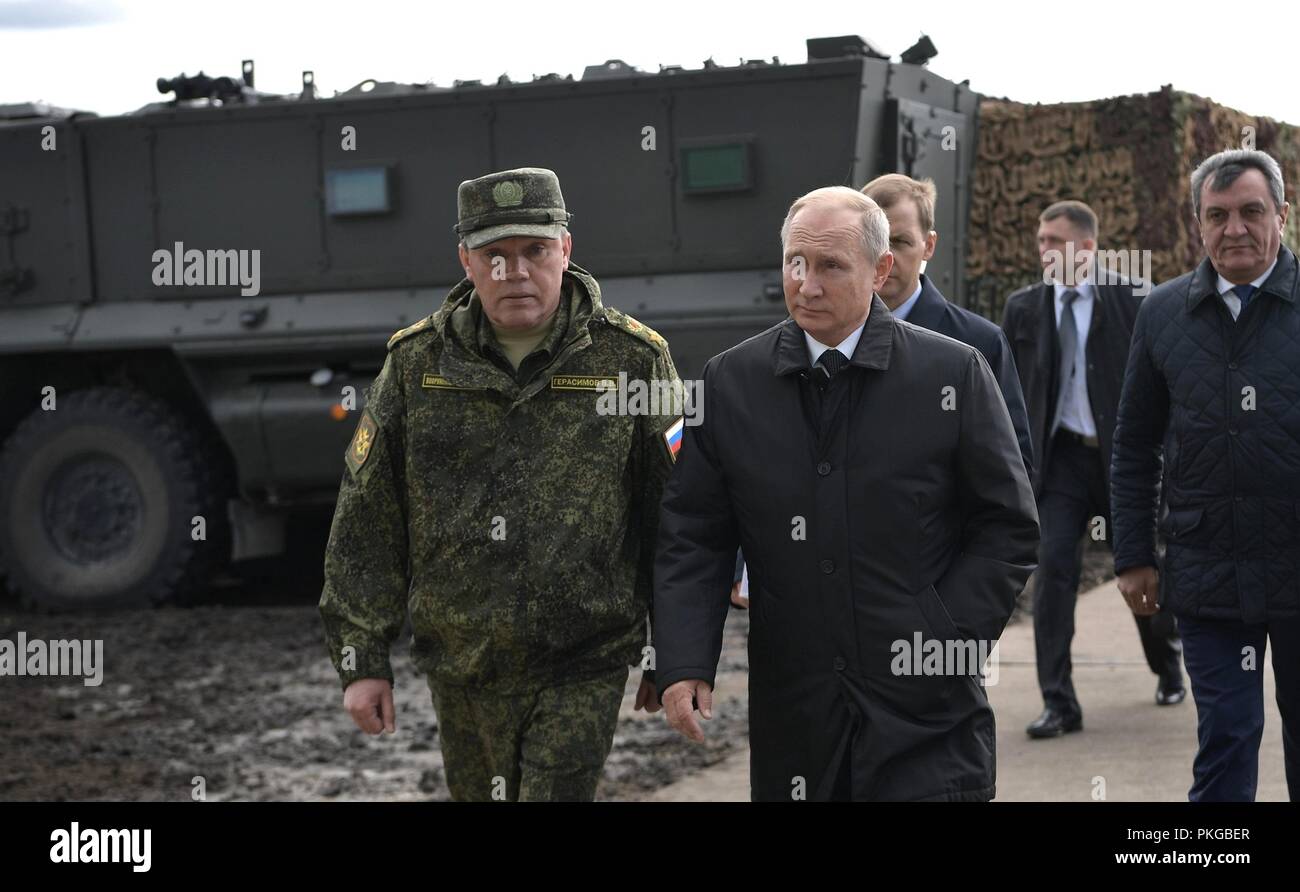 Russian President Vladimir Putin, right, walks with Chief of the ...