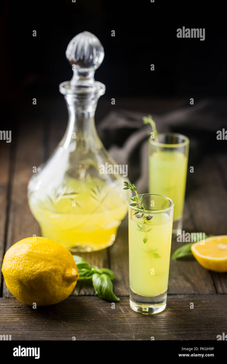 Traditional italian lemon liqueur limoncello and fresh citrus lemon ...