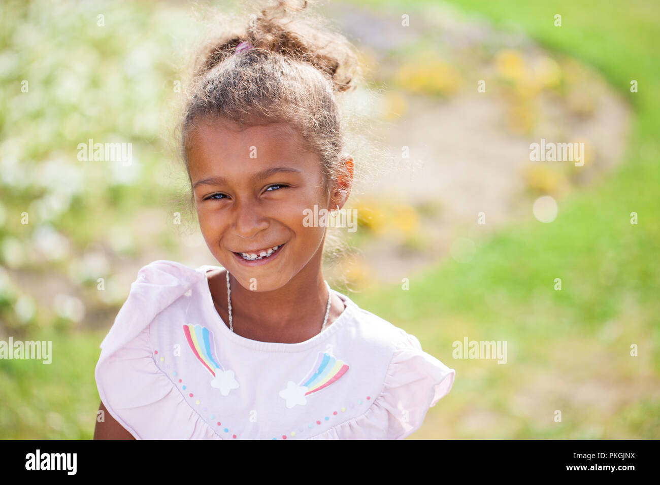 Close up portrait of pretty mixed race African-American little girl ...