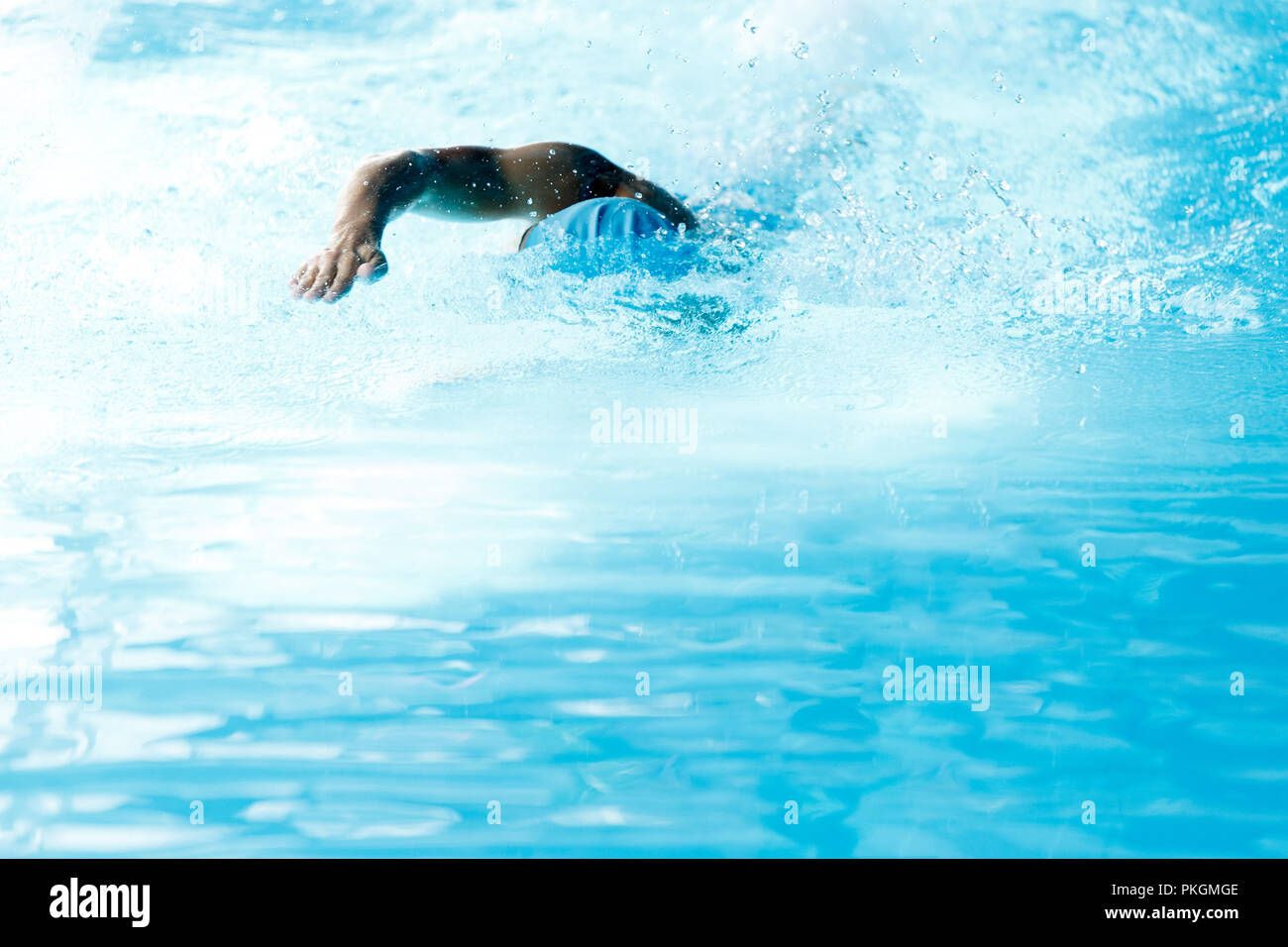 Photo of man swimming in style of crawl in swimming pool on Stock Photo ...