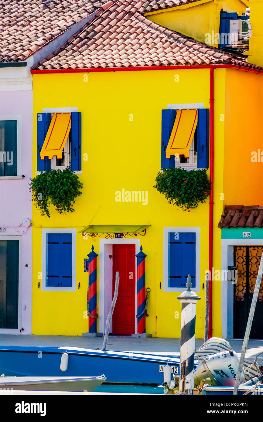 Colorful yellow house on Burano Island, Venice, Italy Stock Photo - Alamy