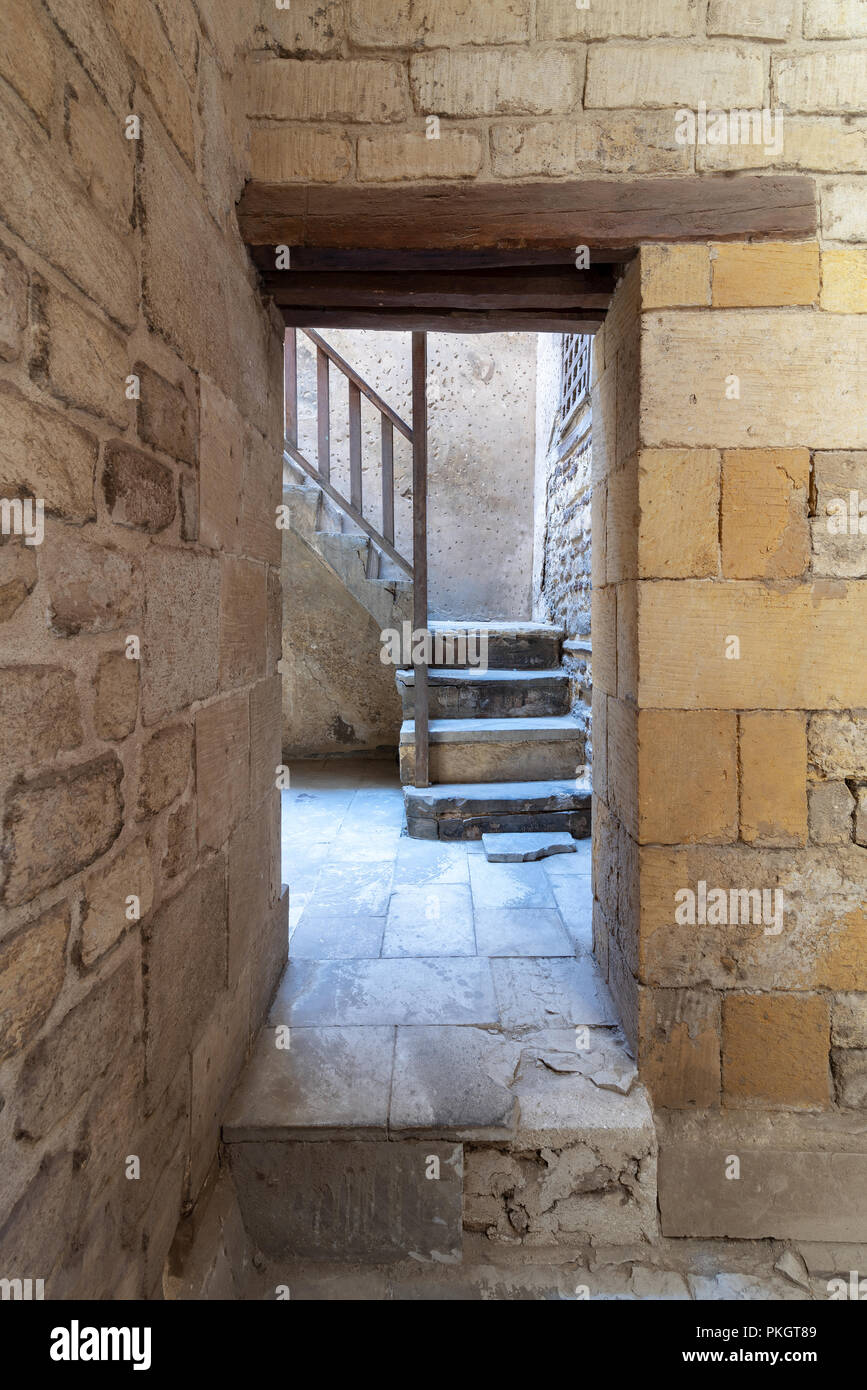 Ancient external old bricks stone wall and doorway revealing a stone ...