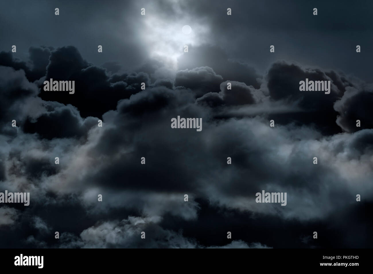 Above the clouds in a covered full moon night Stock Photo - Alamy