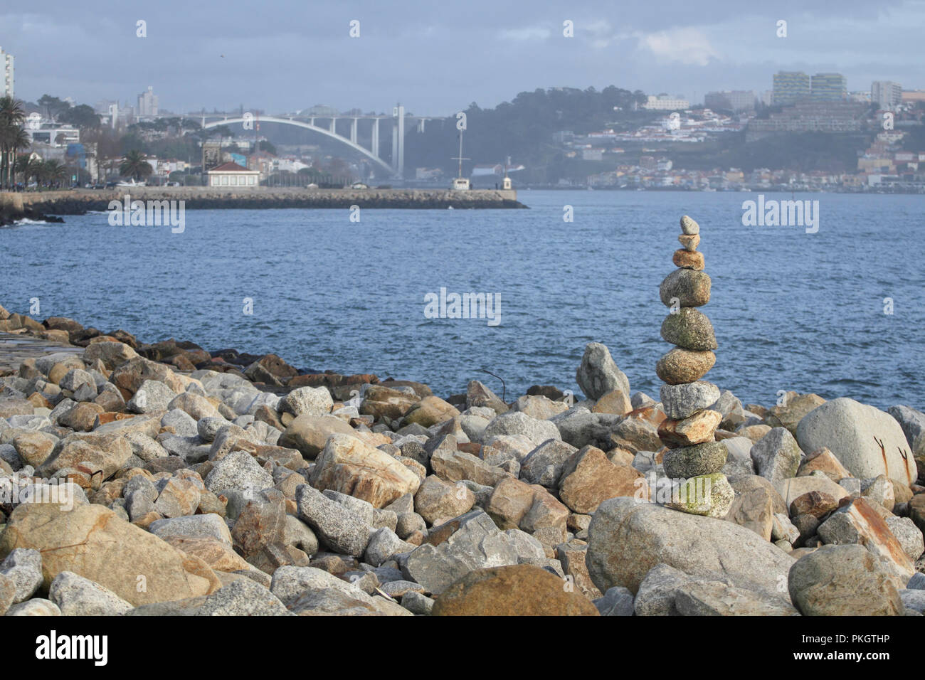 Balanced stones on a river border Stock Photo - Alamy