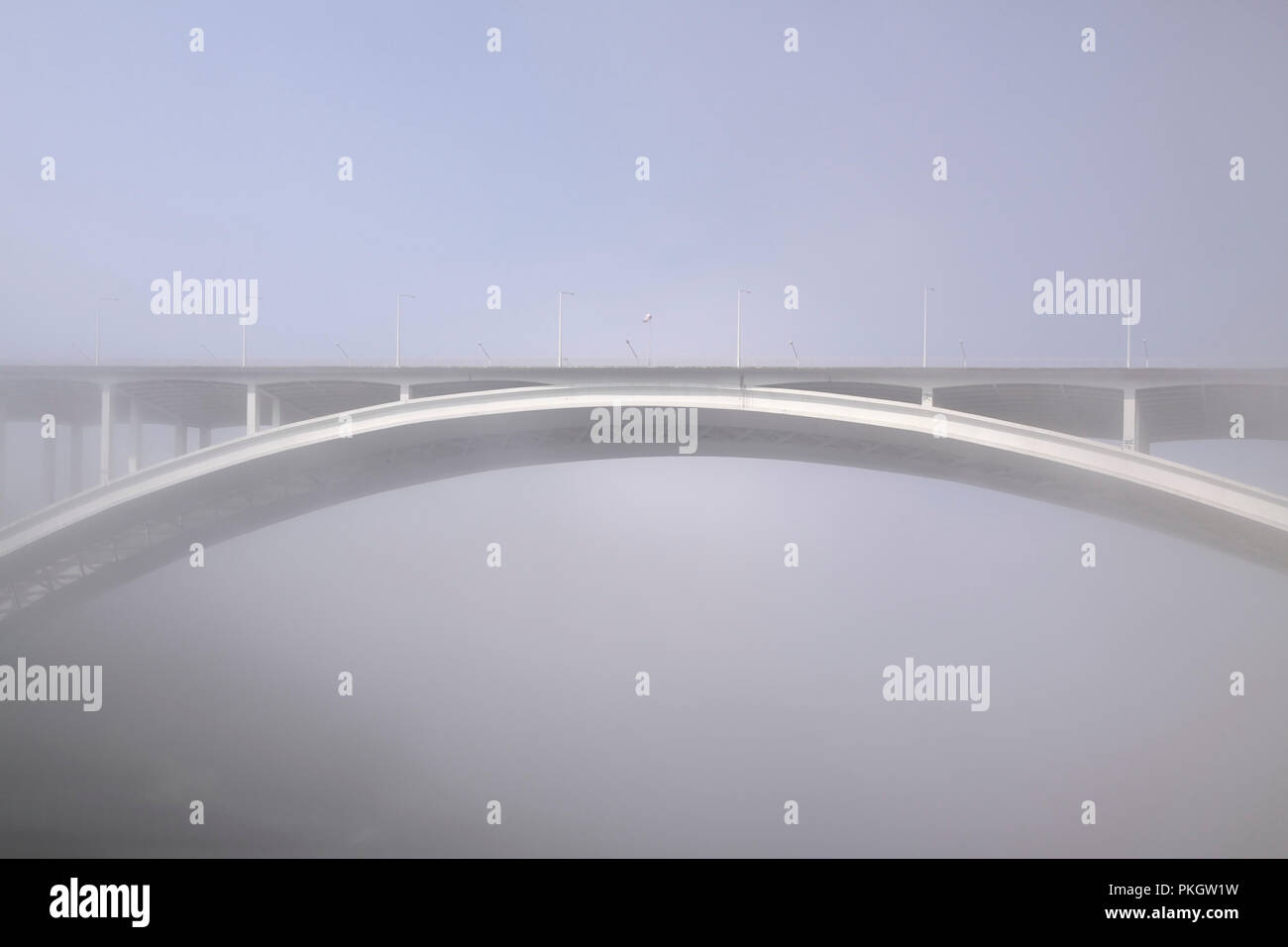 Concrete Arrabida bridge over Douro river in the middle of fog Stock ...