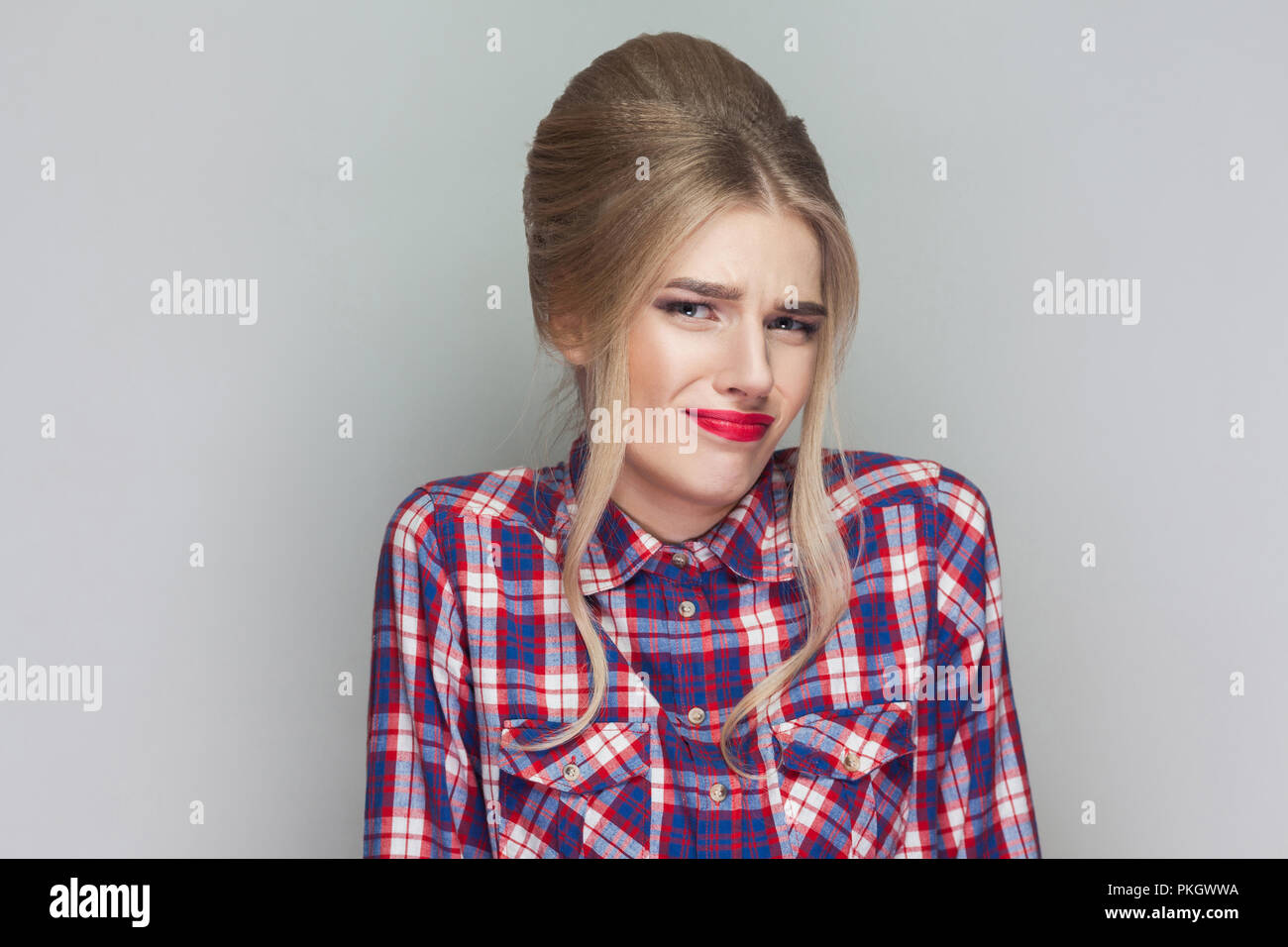 I dont know. confused beautiful girl with pink checkered shirt ...