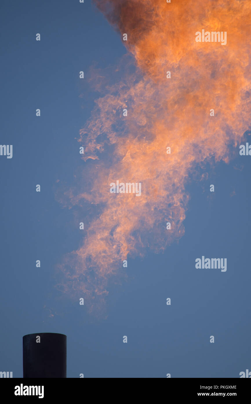 Gas flare burning natural gas for a well test Stock Photo - Alamy