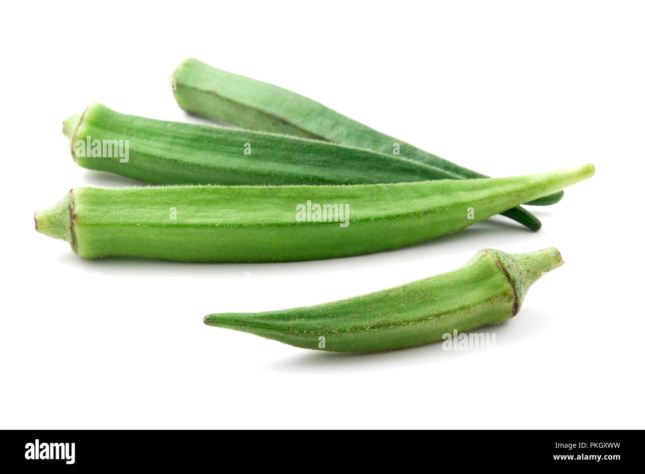 Okra on a white background Stock Photo - Alamy