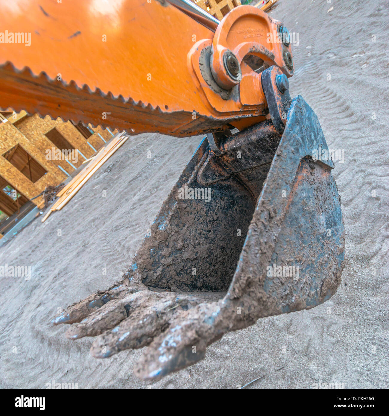 Claw on a tractor for excavating dirt square Stock Photo - Alamy