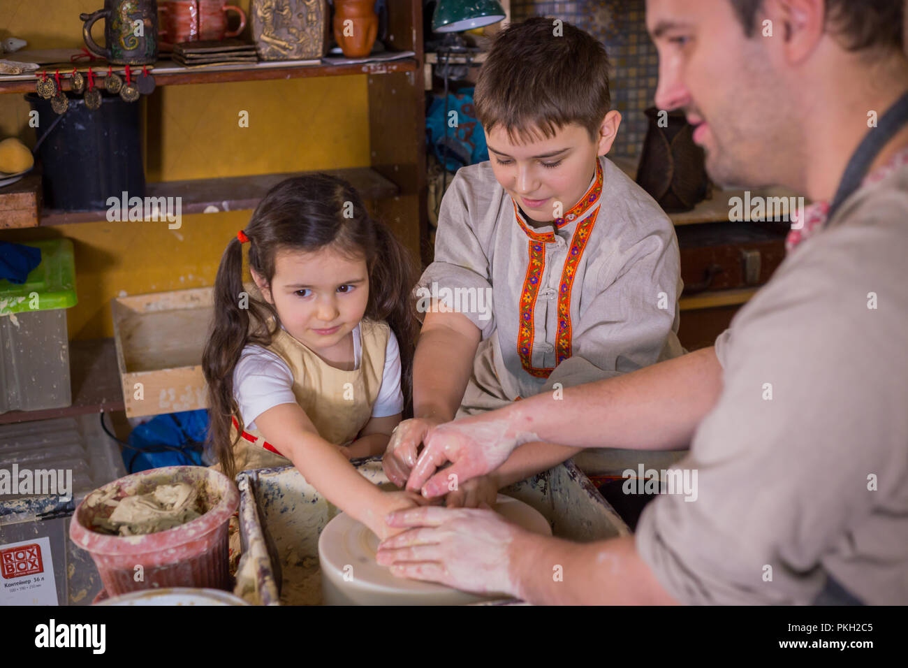 Pottery class and workshop: professional male potter working with ...