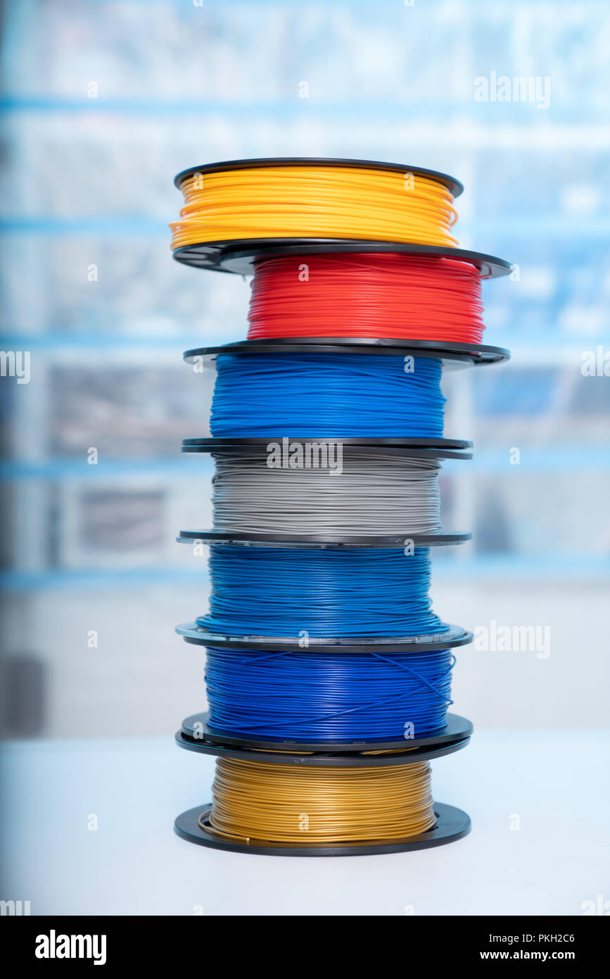 ABS and PLA filament next to 3D Printer. Plastic coils Stock Photo - Alamy