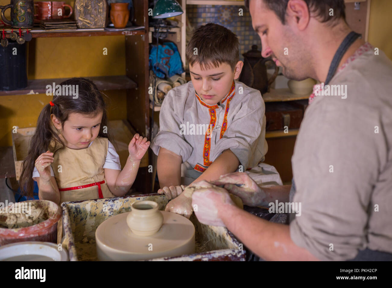 Pottery class and workshop: professional male potter working with ...