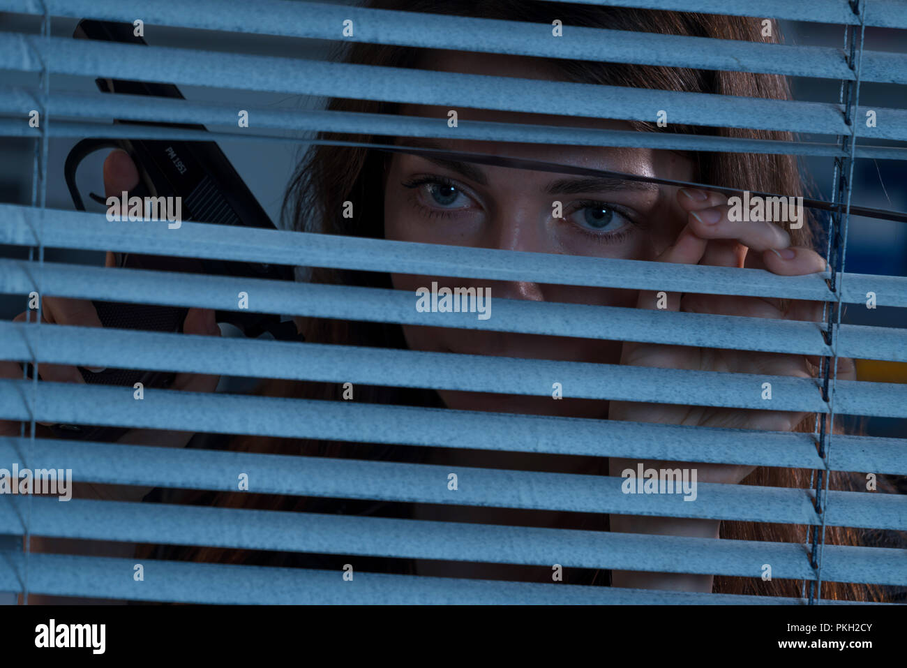 young woman with a gun at the window Stock Photo - Alamy