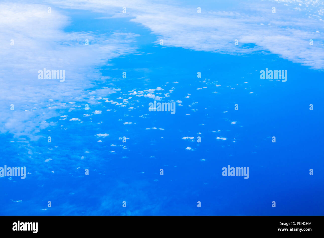 Aerial birds eye view above clouds of the blue sky Stock Photo - Alamy