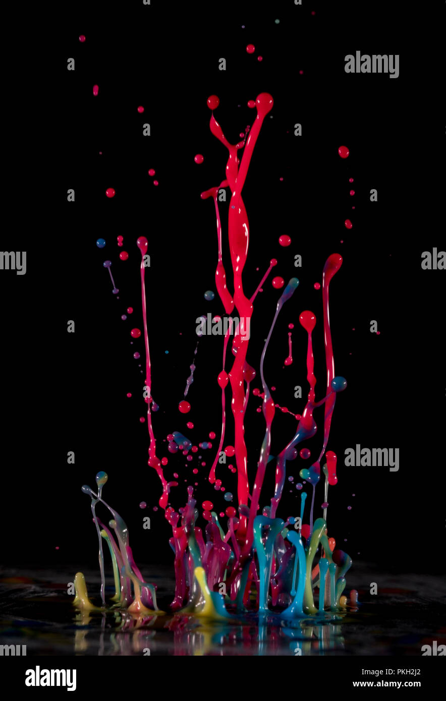 Abstract sculptures of colorful splashes of paint. Dancing liquid on a ...