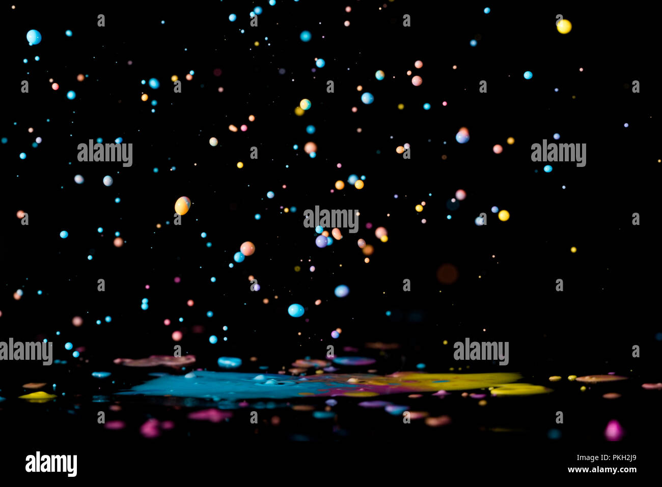 Abstract sculptures of colorful splashes of paint. Dancing liquid on a ...