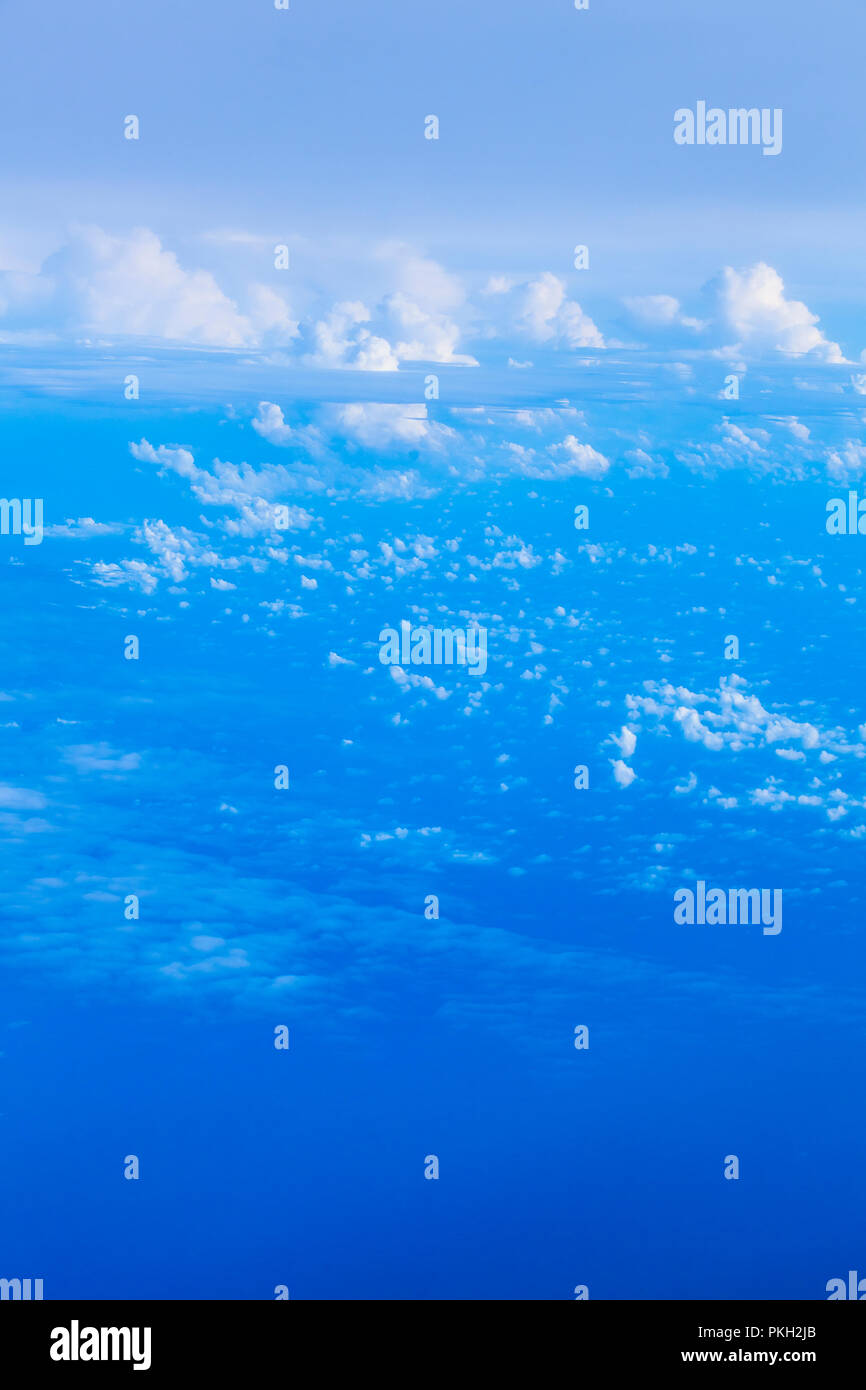 Aerial birds eye view above clouds of the blue sky Stock Photo - Alamy