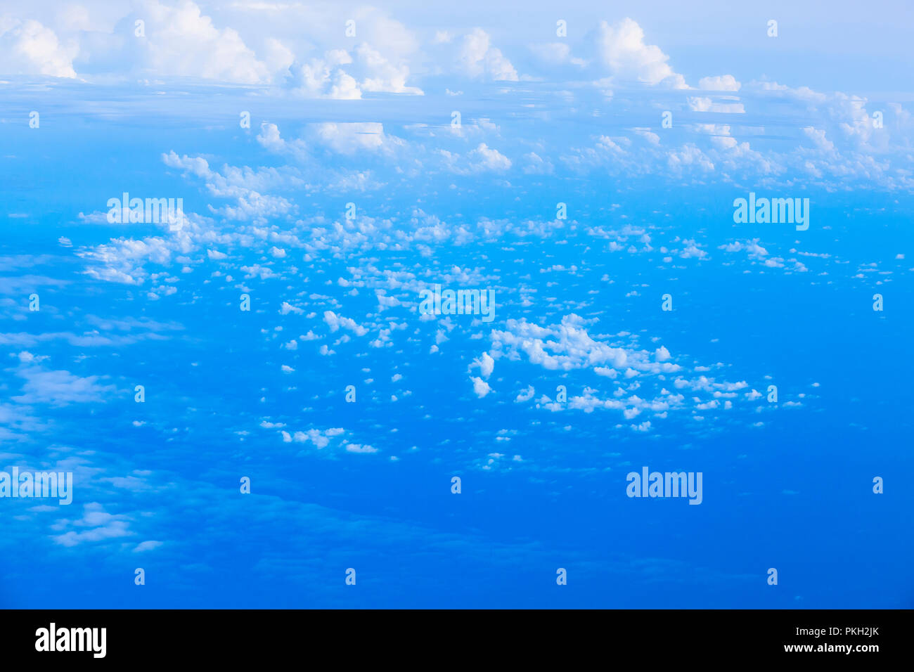 Aerial birds eye view above clouds of the blue sky Stock Photo - Alamy