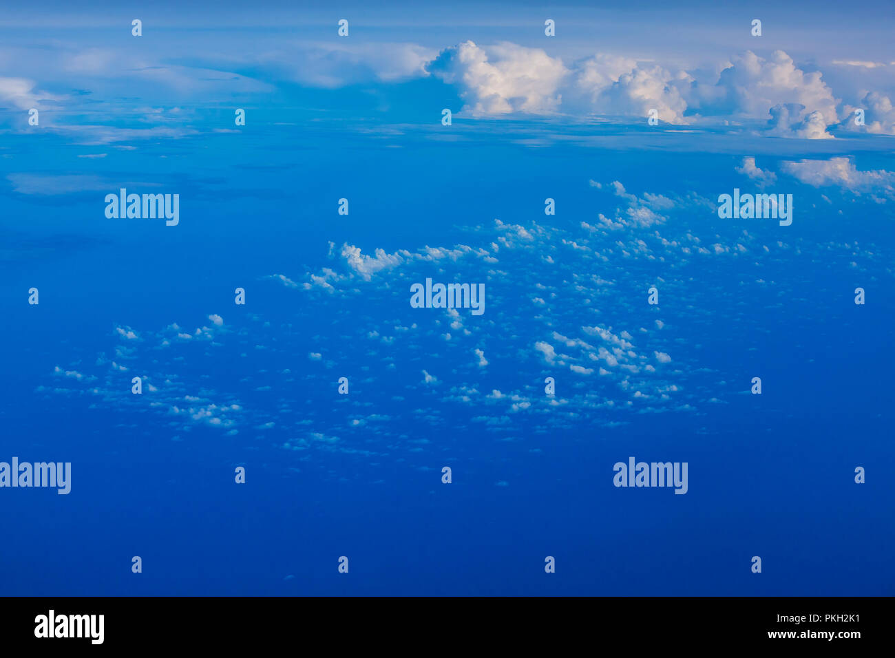 Aerial birds eye view above clouds of the blue sky Stock Photo - Alamy