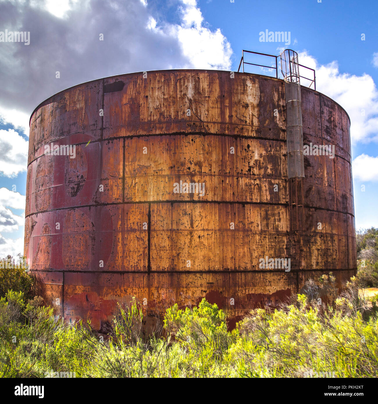 Dilapidated tank beneath clouds and sky Stock Photo - Alamy