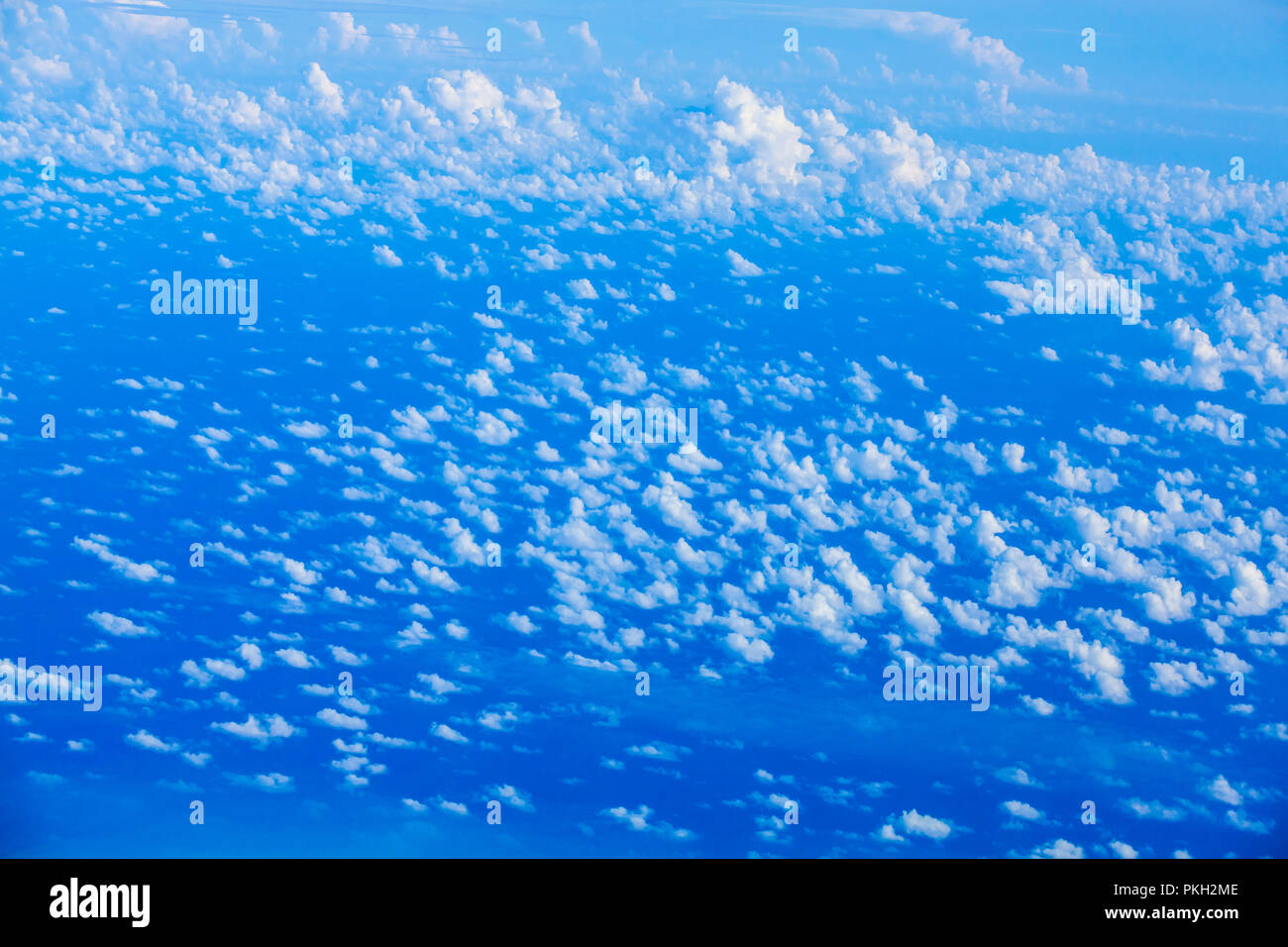 Aerial birds eye view above clouds of the blue sky Stock Photo - Alamy