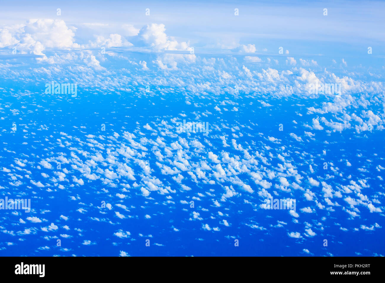 Aerial birds eye view above clouds of the blue sky Stock Photo - Alamy