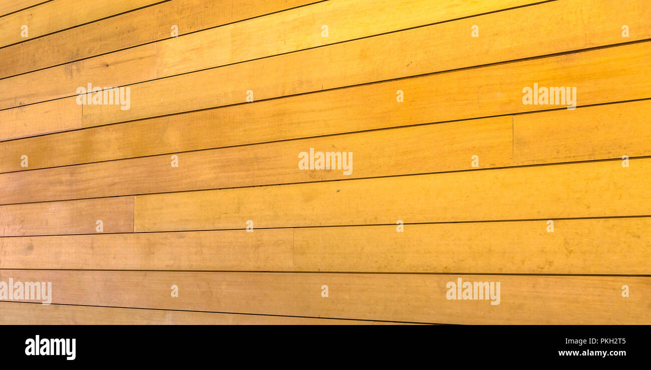 Exterior wood wall with golden brown color Stock Photo - Alamy