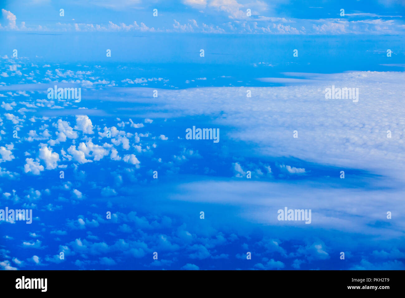 Aerial birds eye view above clouds of the blue sky Stock Photo - Alamy