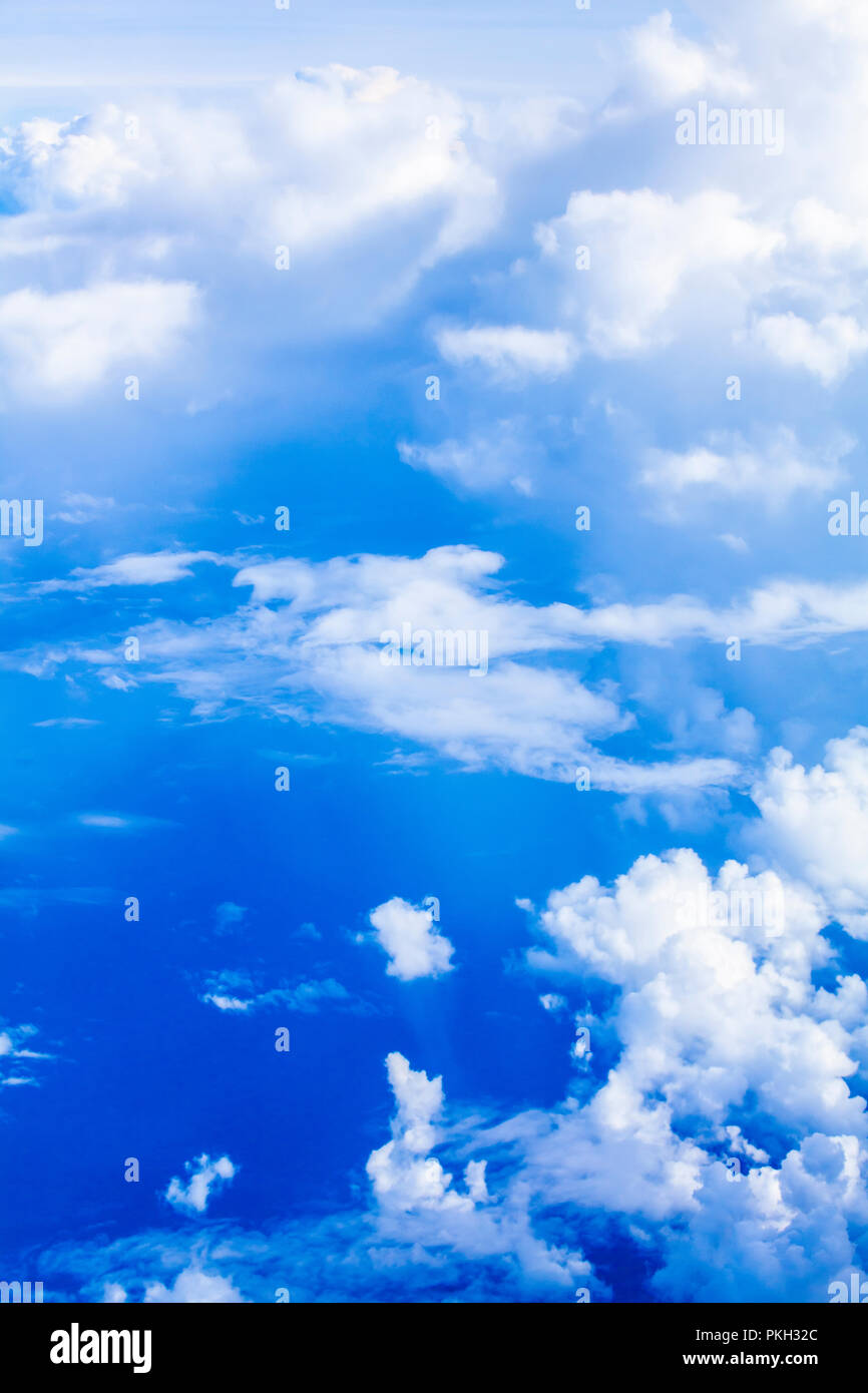 Aerial birds eye view above clouds of the blue sky Stock Photo - Alamy