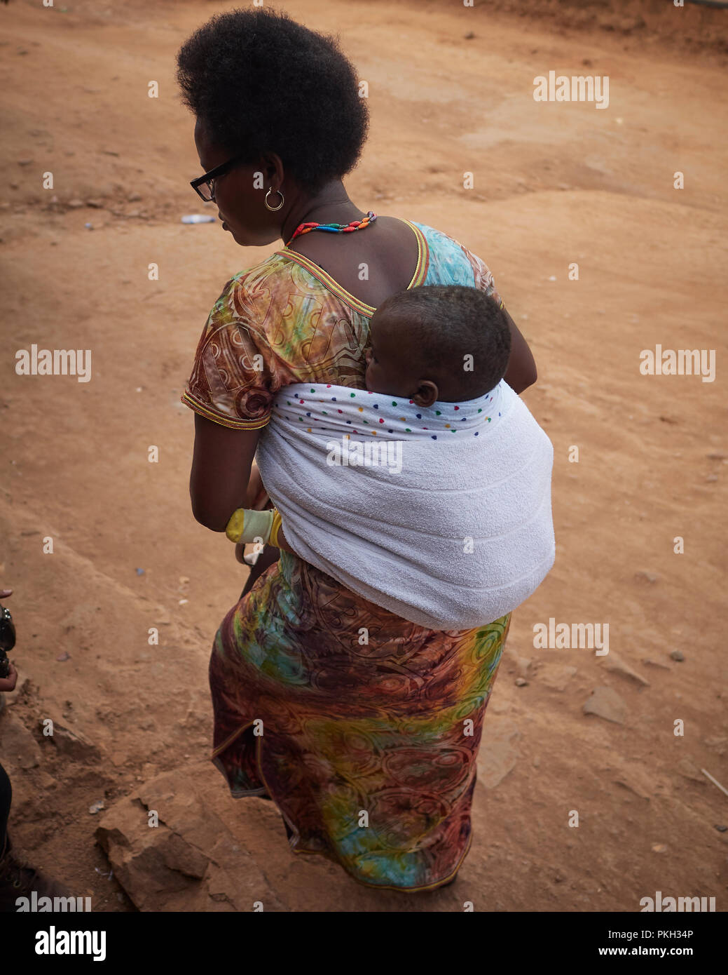 baby on her back, mother in Kigali, Rwanda Stock Photo - Alamy
