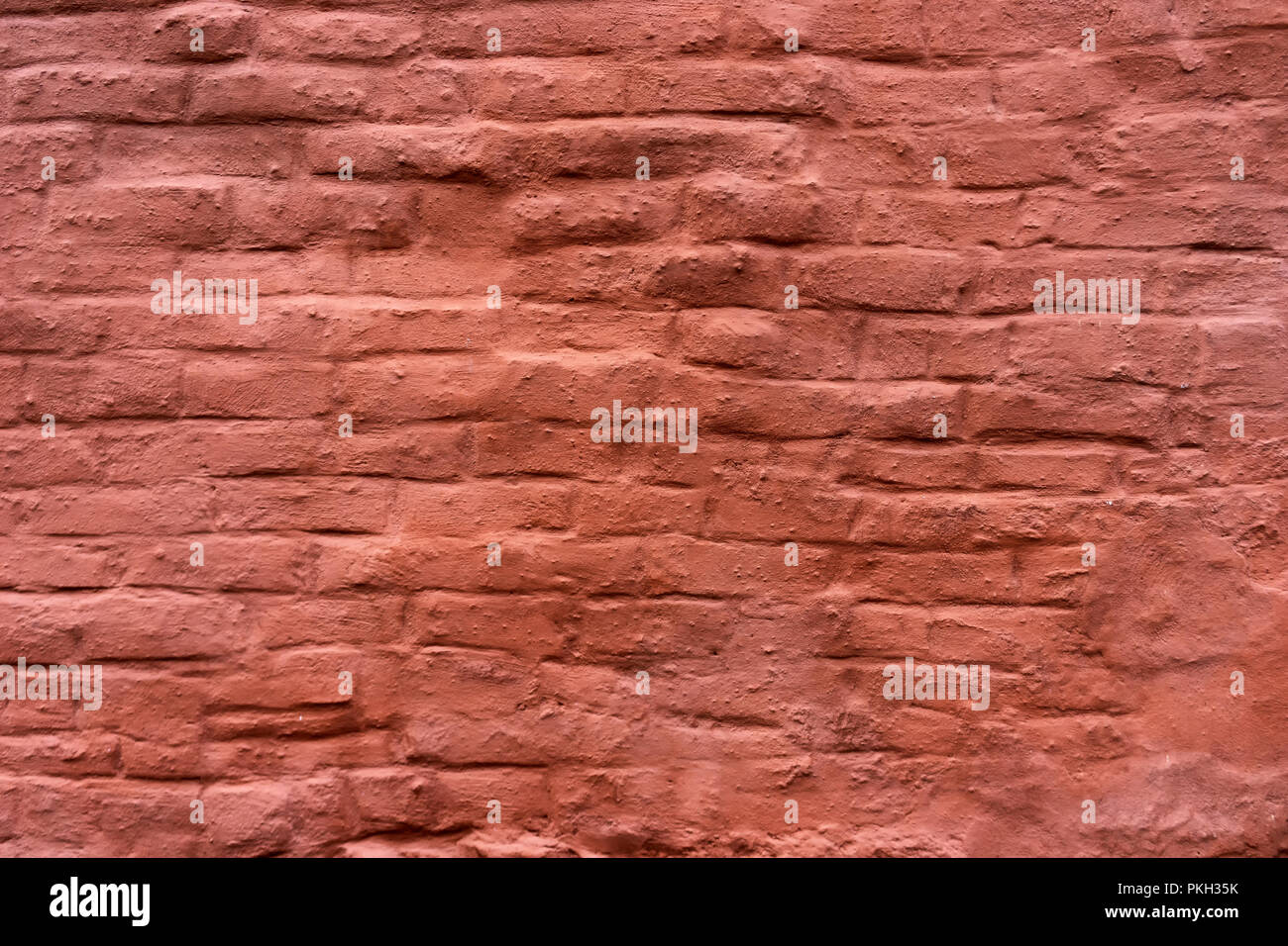 Painted uneven brick wall Stock Photo - Alamy