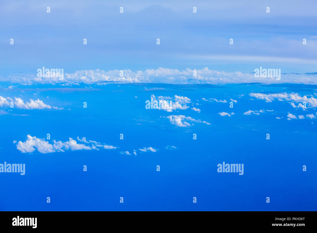 Aerial birds eye view above clouds of the blue sky Stock Photo - Alamy