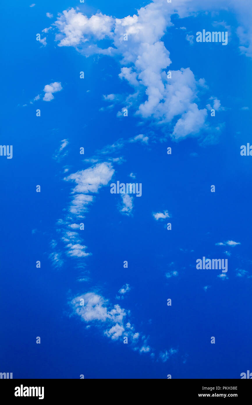 Aerial birds eye view above clouds of the blue sky Stock Photo - Alamy