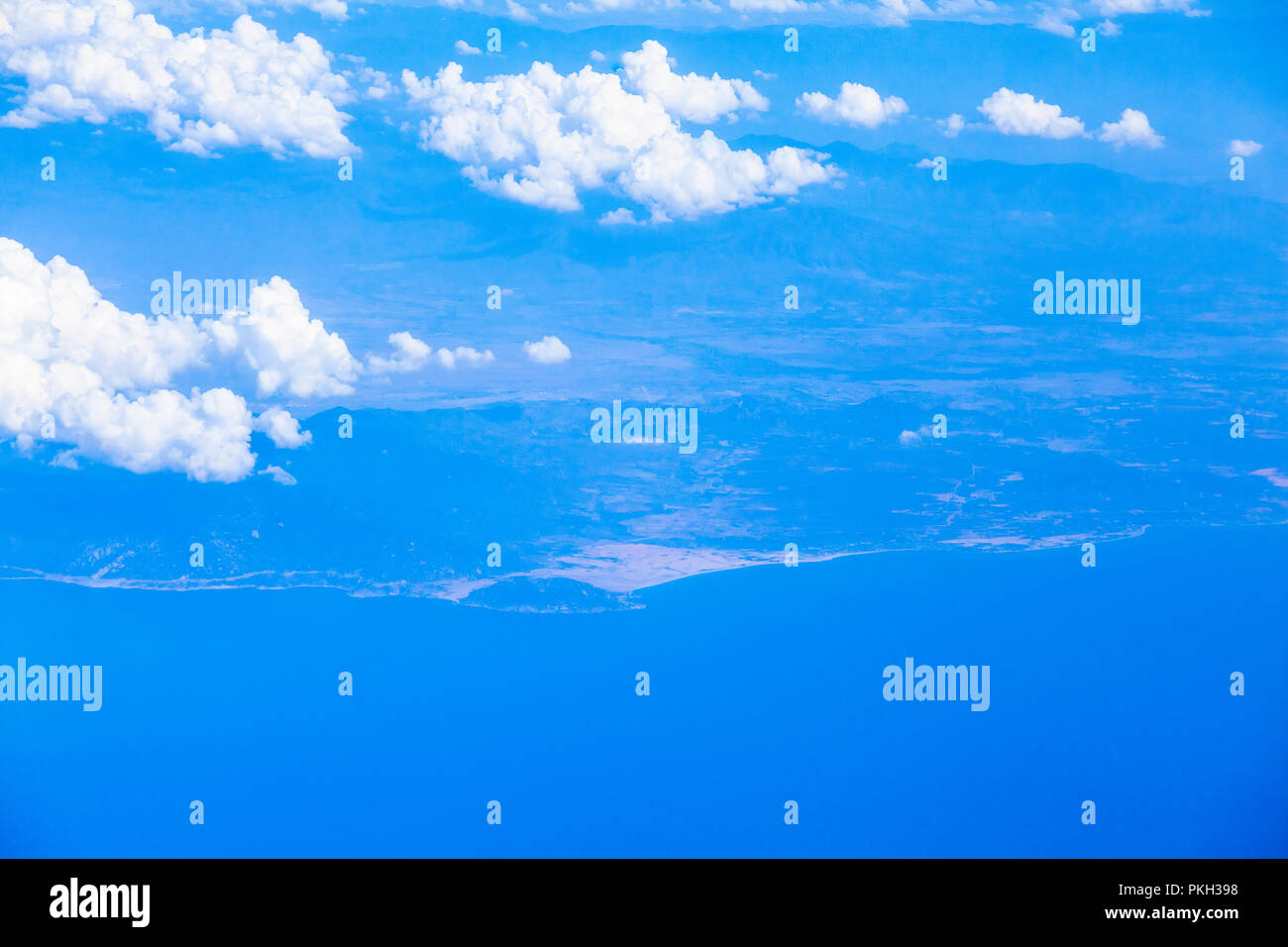 Aerial birds eye view above clouds of the blue sky Stock Photo - Alamy